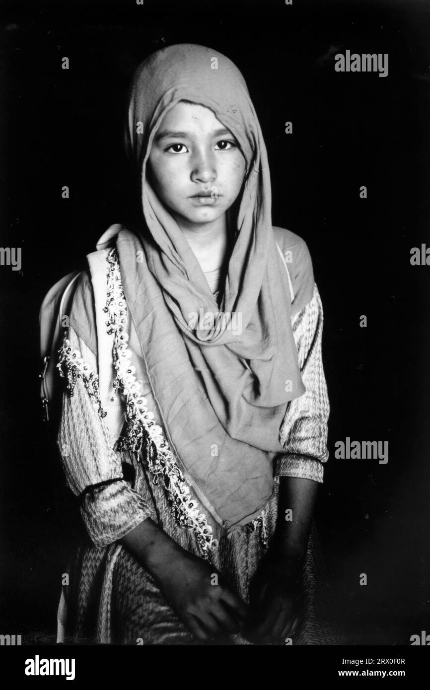 Student Madina, 9, poses for a portrait inside her school in the Surqul ...
