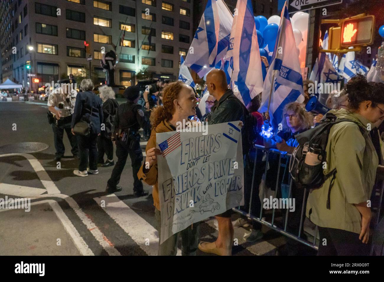NEW YORK, NEW YORK - SEPTEMBER 21: A protester holds a "Friends Don't ...