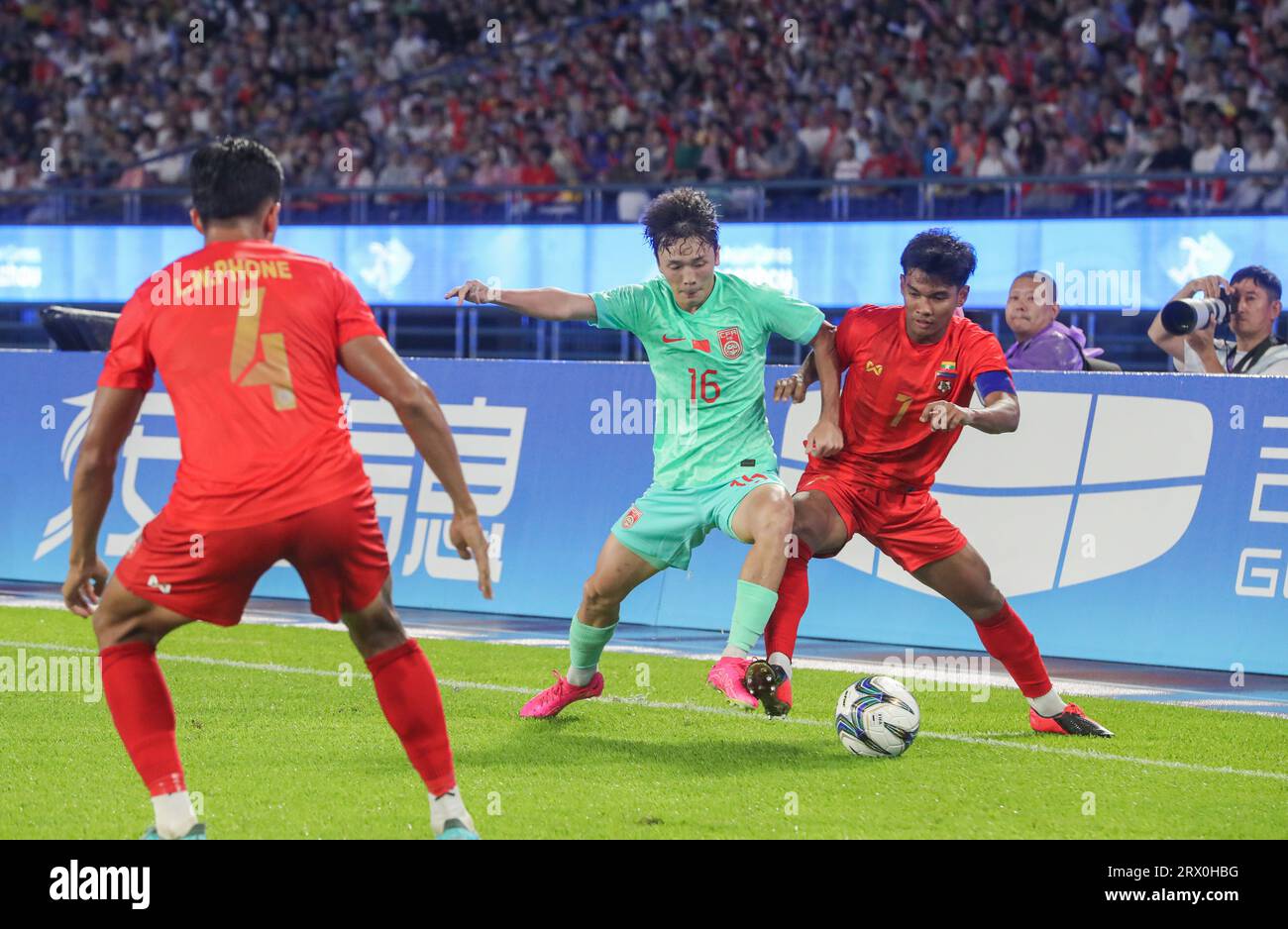 The men's football group match between China and Myanmar (RED) at the ...