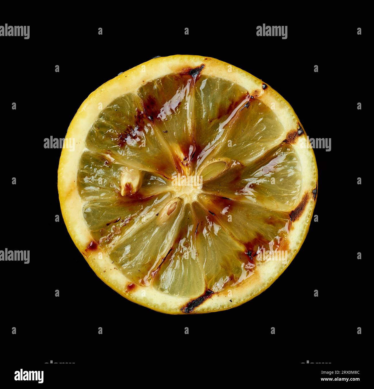grilled juicy lemon slice isolated on black background, top view Stock ...