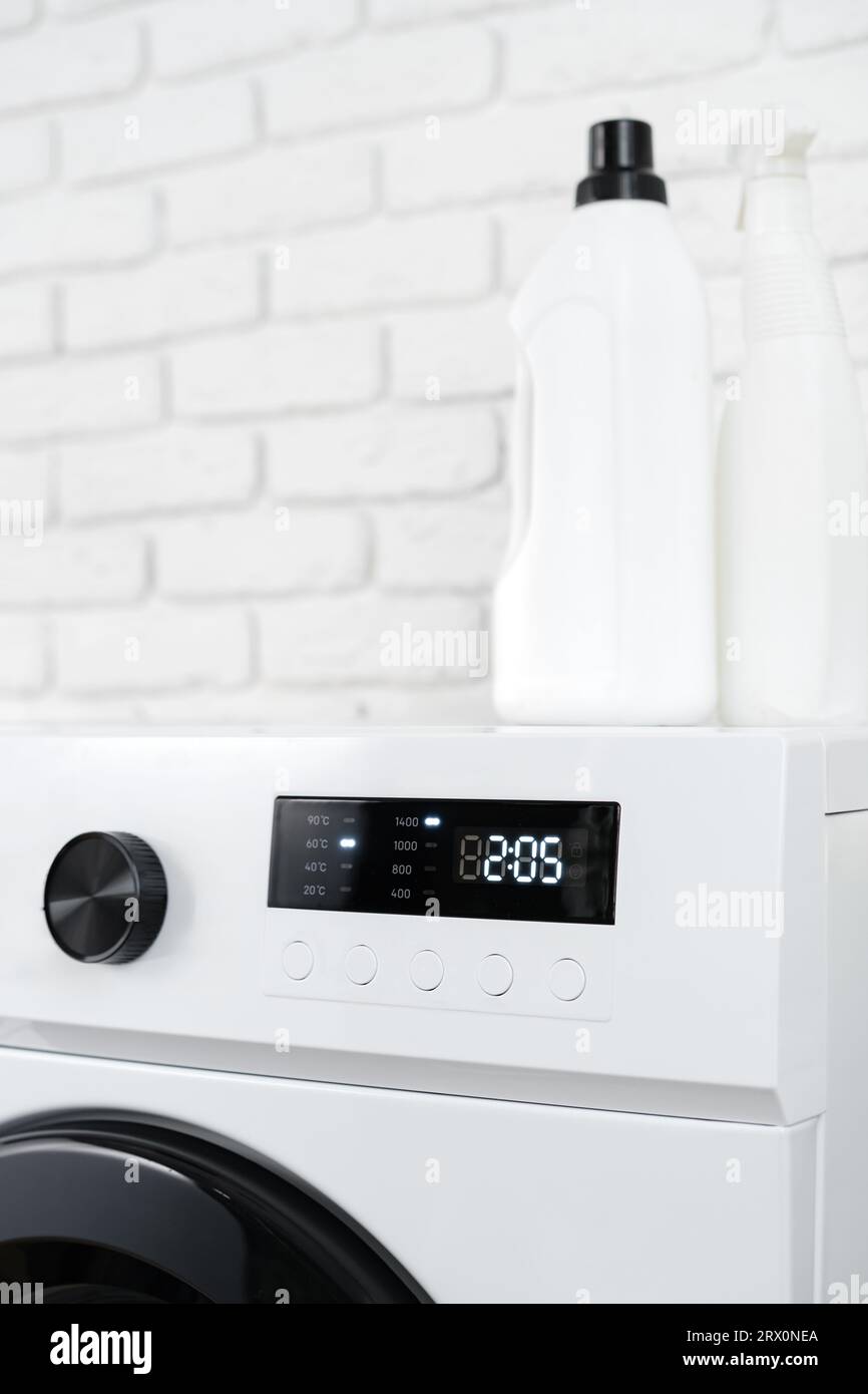 Laundry washing detergents containers on washing machine Stock Photo ...