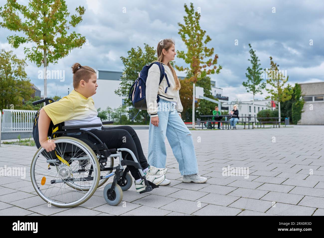 Children classmates going to school together, boy in wheelchair and ...