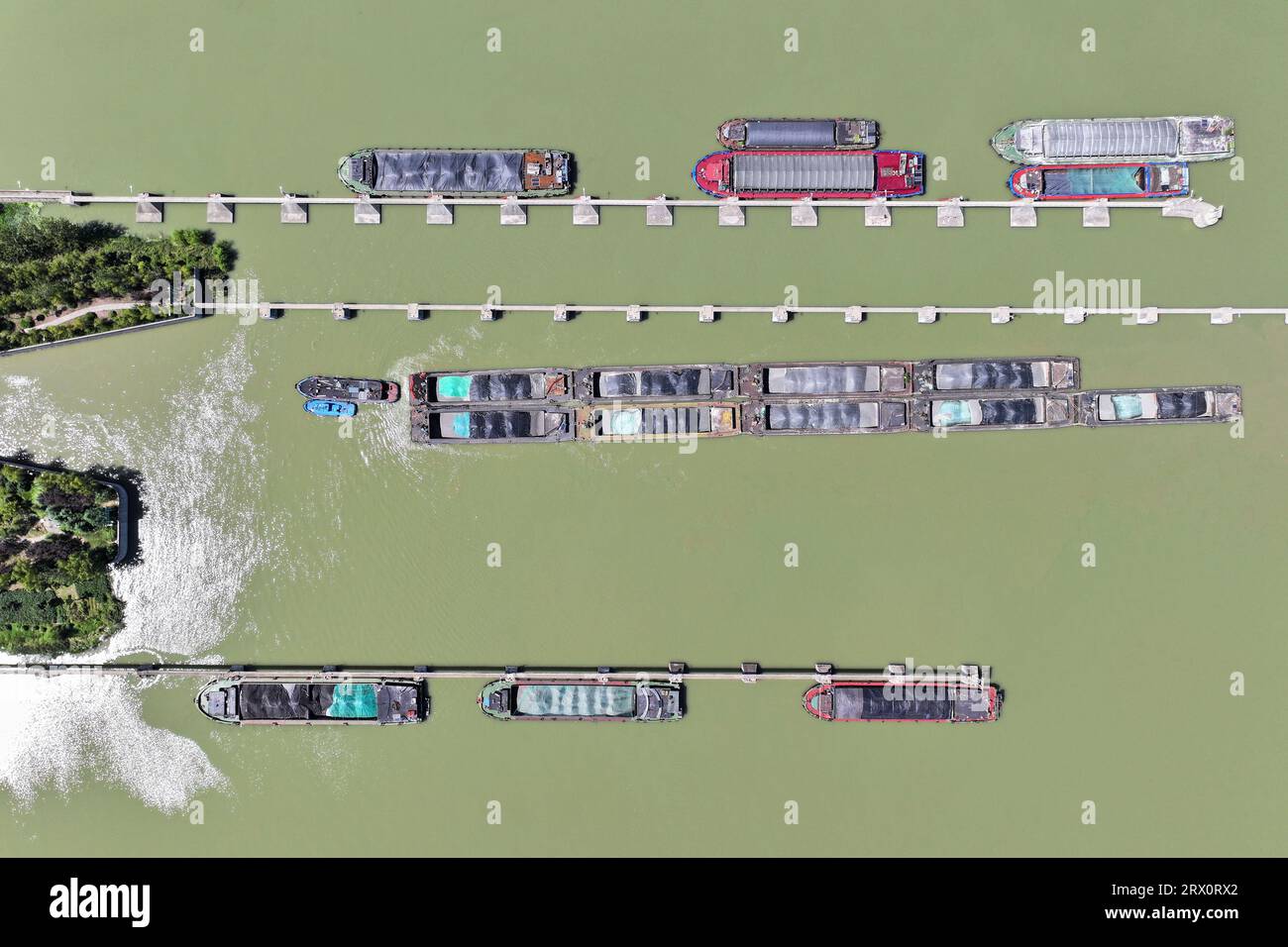 SUQIAN, CHINA - SEPTEMBER 22, 2023 - Cargo ships pass through the Zaohe ...