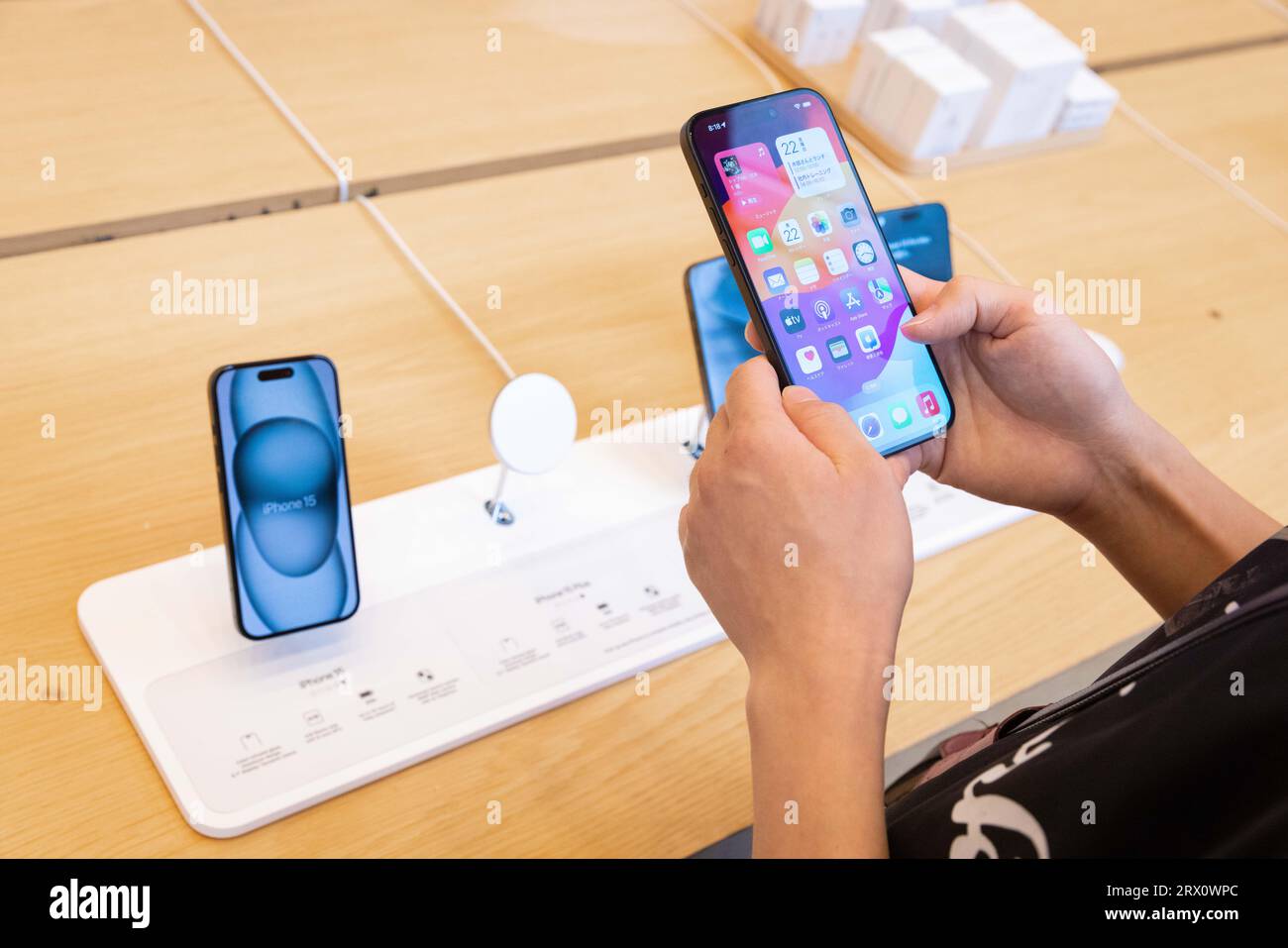 Customer interacts with the new iPhone 15 inside an Apple Store in ...