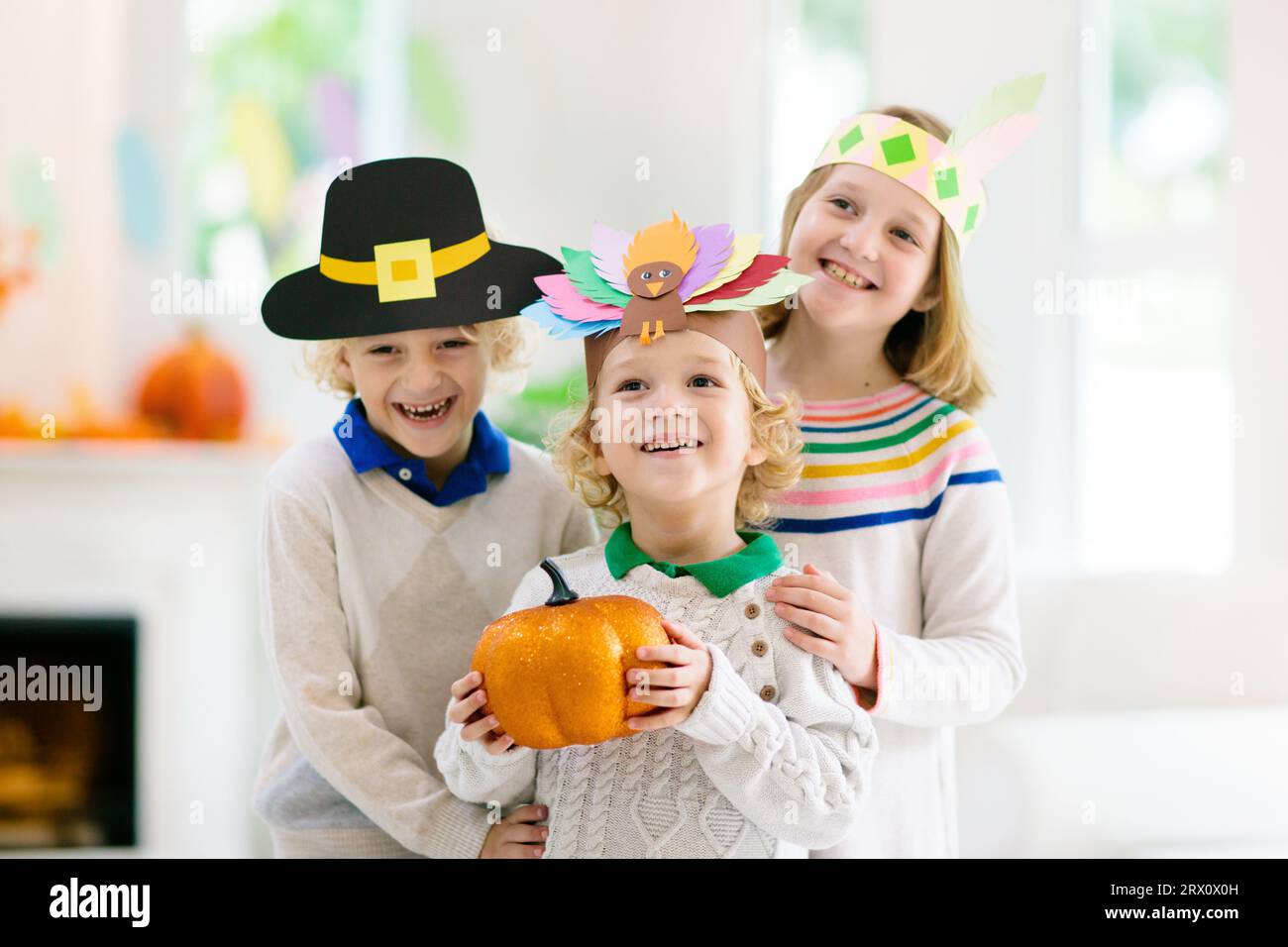 Child celebrating Thanksgiving. Kid in paper turkey hat, native ...