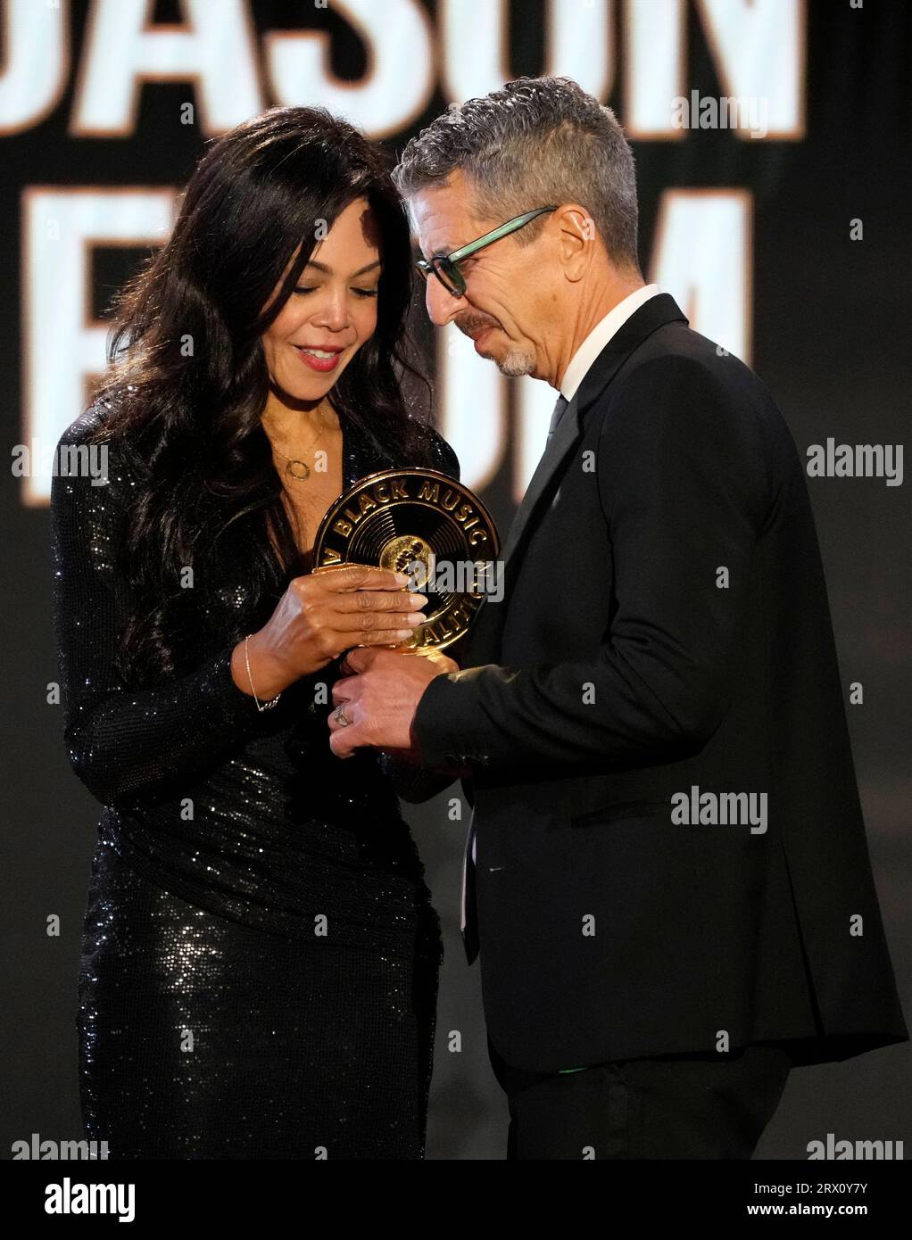 Music industry executive and podcaster Jason Flom, right, accepts the ...