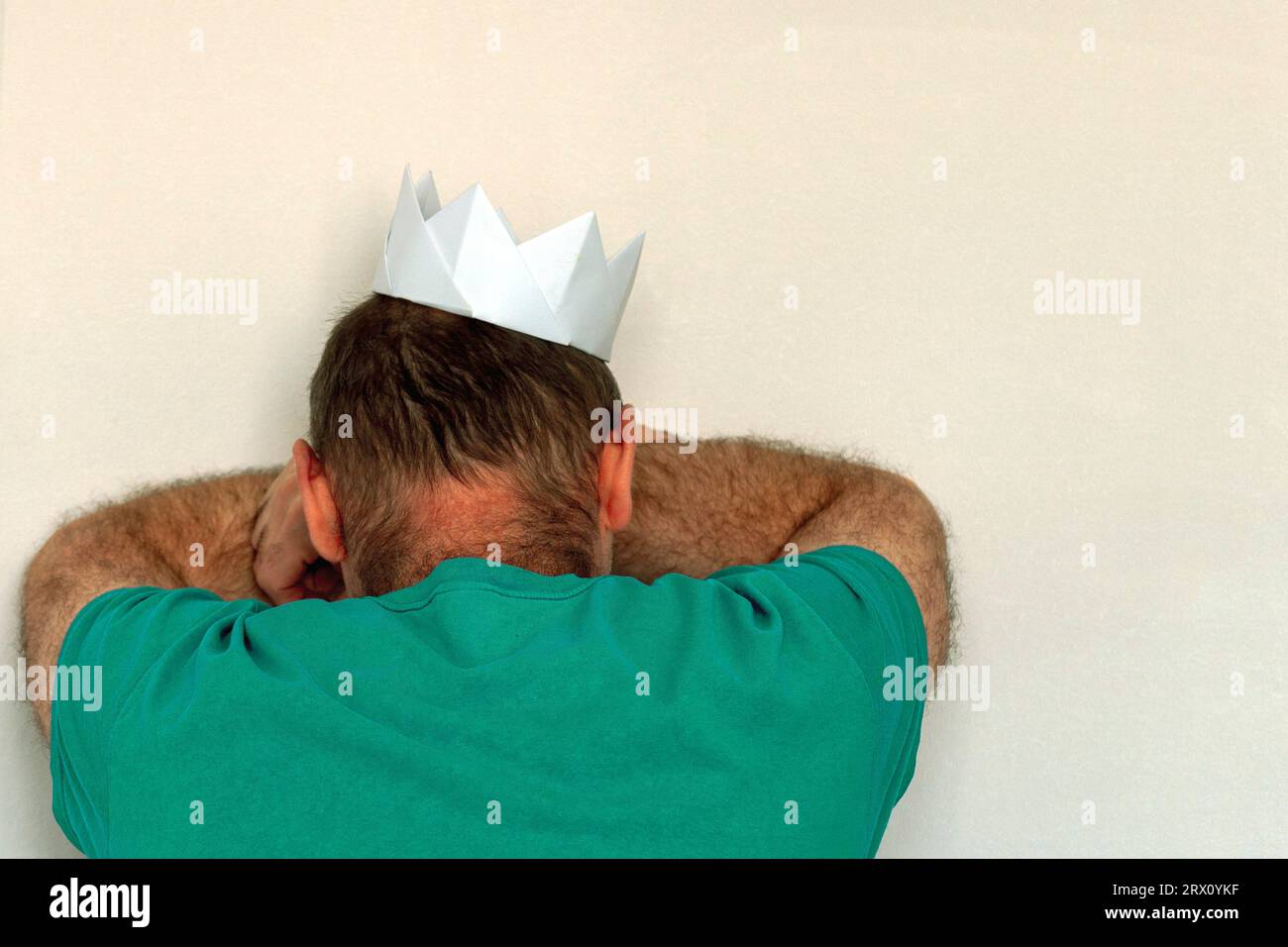 man with white paper crown. The concept king. A man with a crown. Back ...