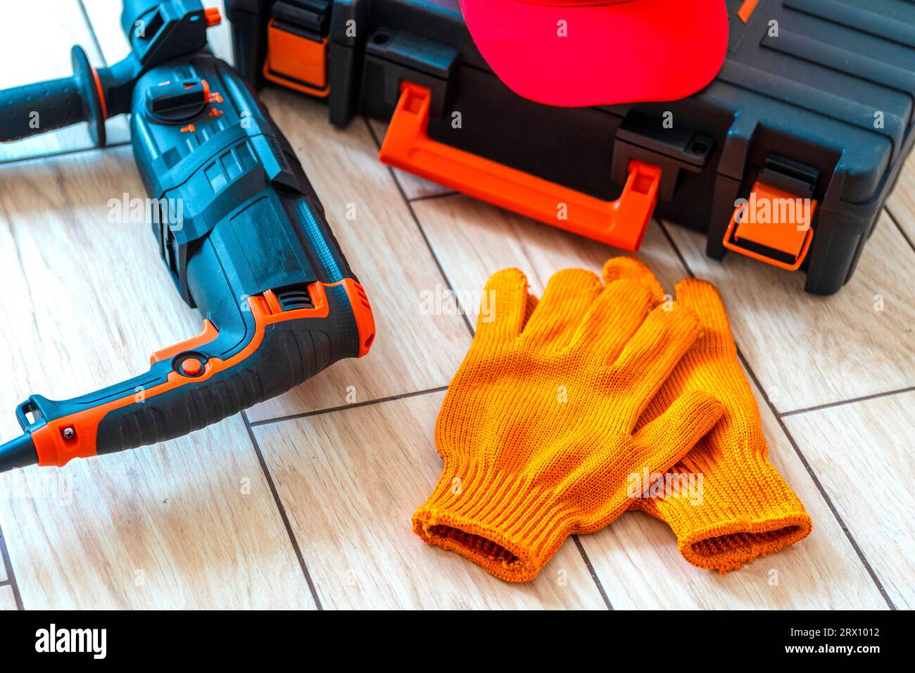 Top view of Working tools.rotary hammer, tool box, work cap, gloves ...