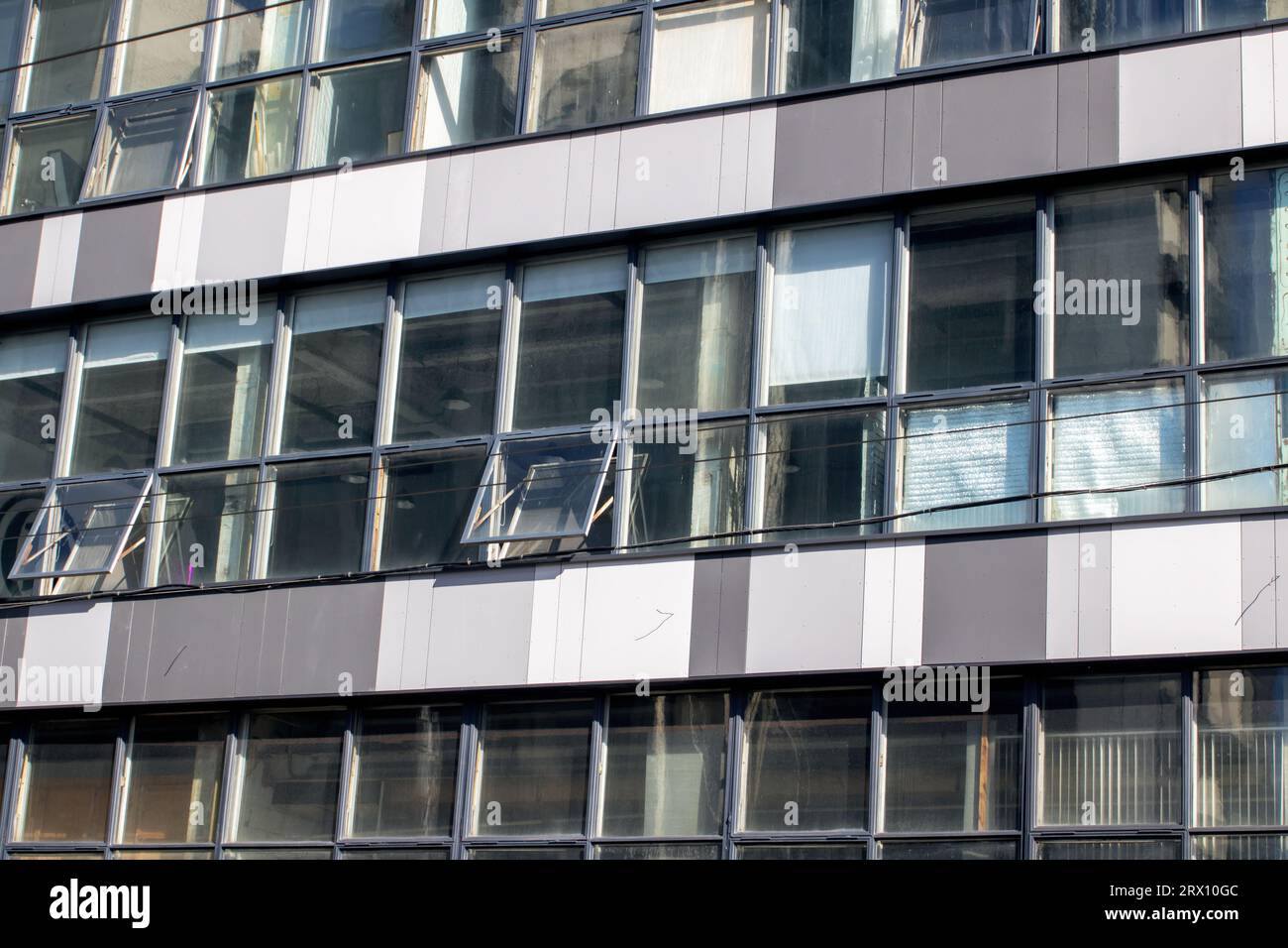 Apartment building facade glowing windows hi-res stock photography and ...
