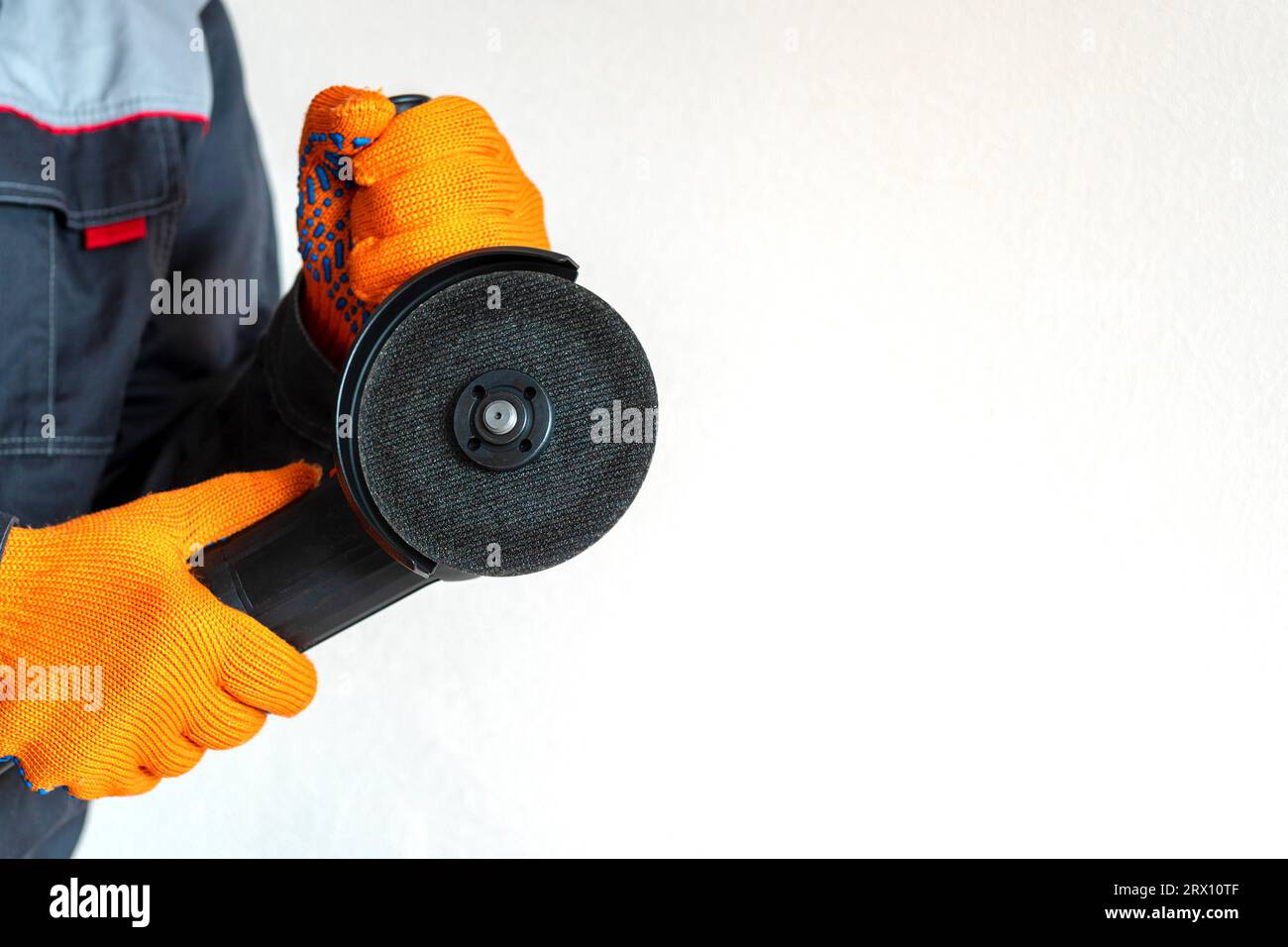 Disc grinder. Grinder in the hand. Close-up. Copy space Stock Photo - Alamy