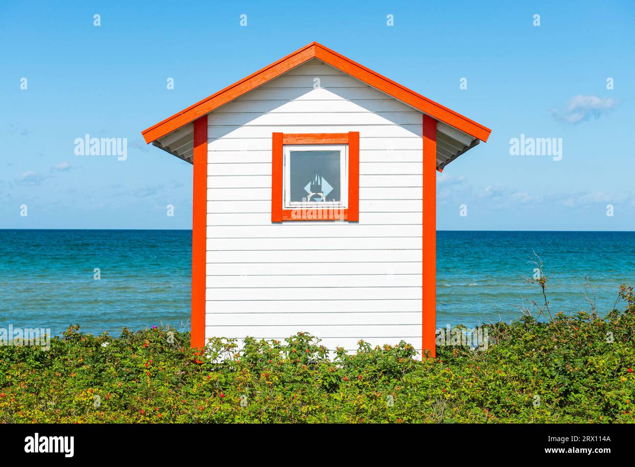 Frontal view of the back of a white orange wooden bathing hut on the ...