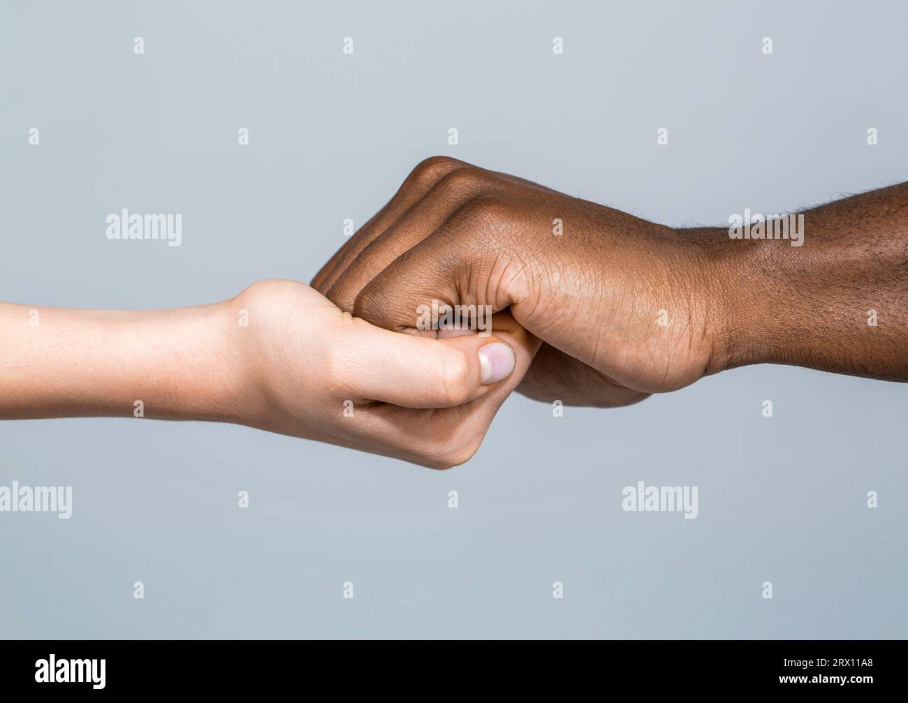Black and white human hands. African and caucasian hands. Giving a ...