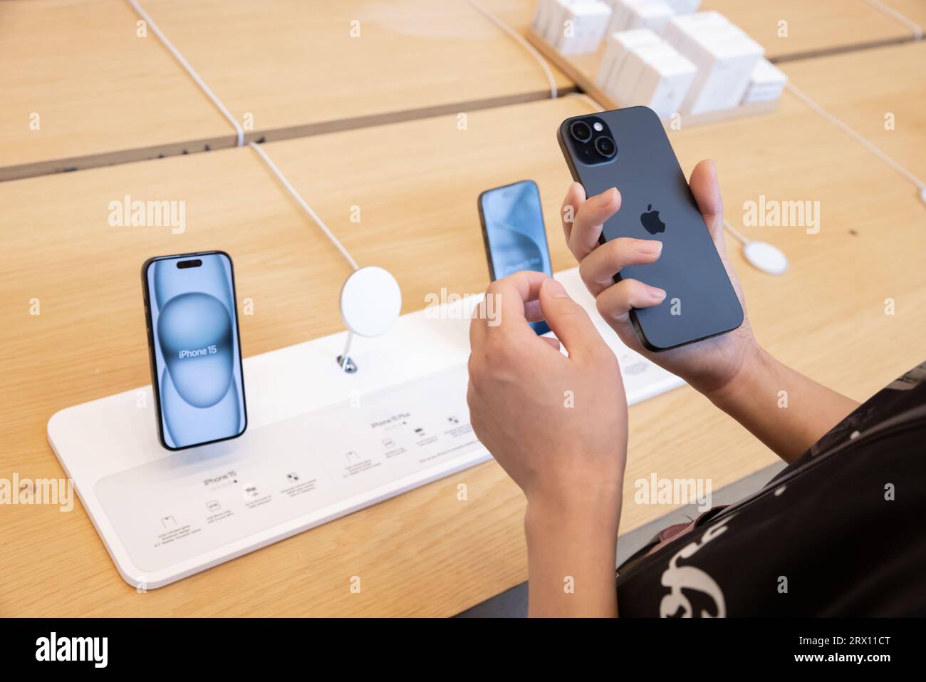 Tokyo, Japan. 22nd Sep, 2023. Customer interacts with the new iPhone 15 ...