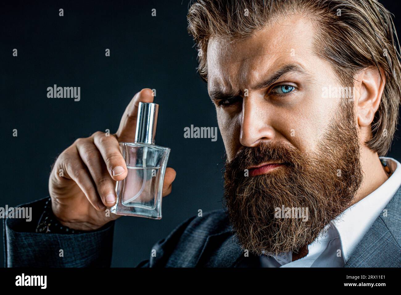 Masculine perfume. Male fragrance and perfumery, cosmetics. Bearded man ...