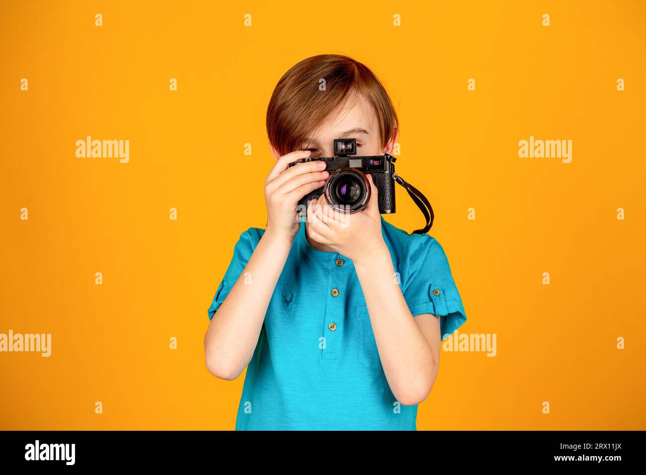 Boy using a cameras. Baby boy with camera. Cheerful smiling child ...