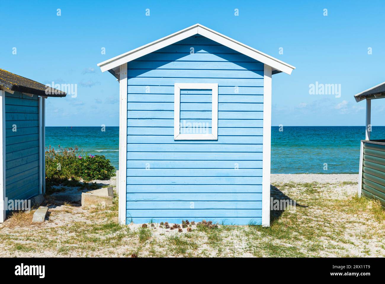 Frontal view of the back of a blue and white wooden bathing hut on the ...