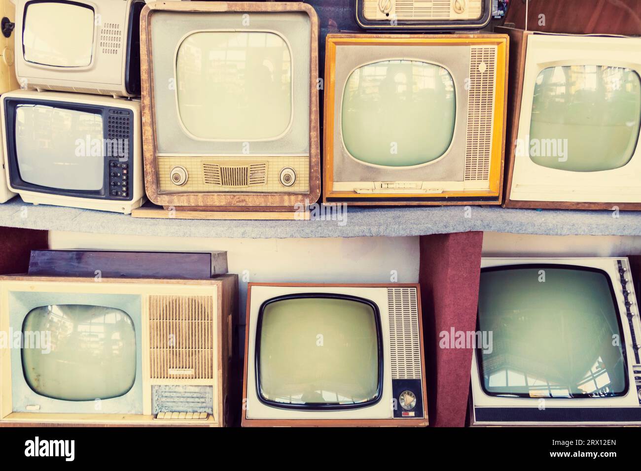 Many retro television. vintage old TV is colorful multi-row. Seeing the ...