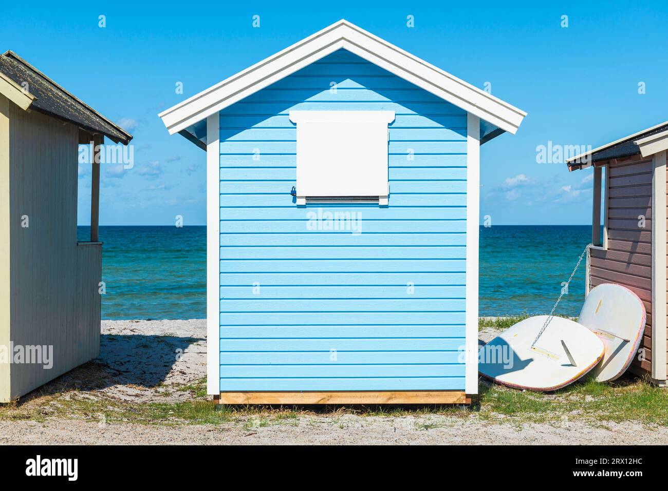 Frontal view of the back of a blue and white wooden bathing hut on the ...