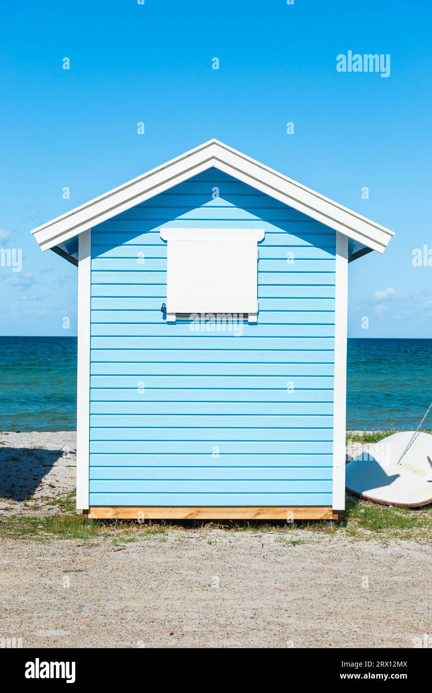 Frontal view of the back of a blue and white wooden bathing hut on the ...