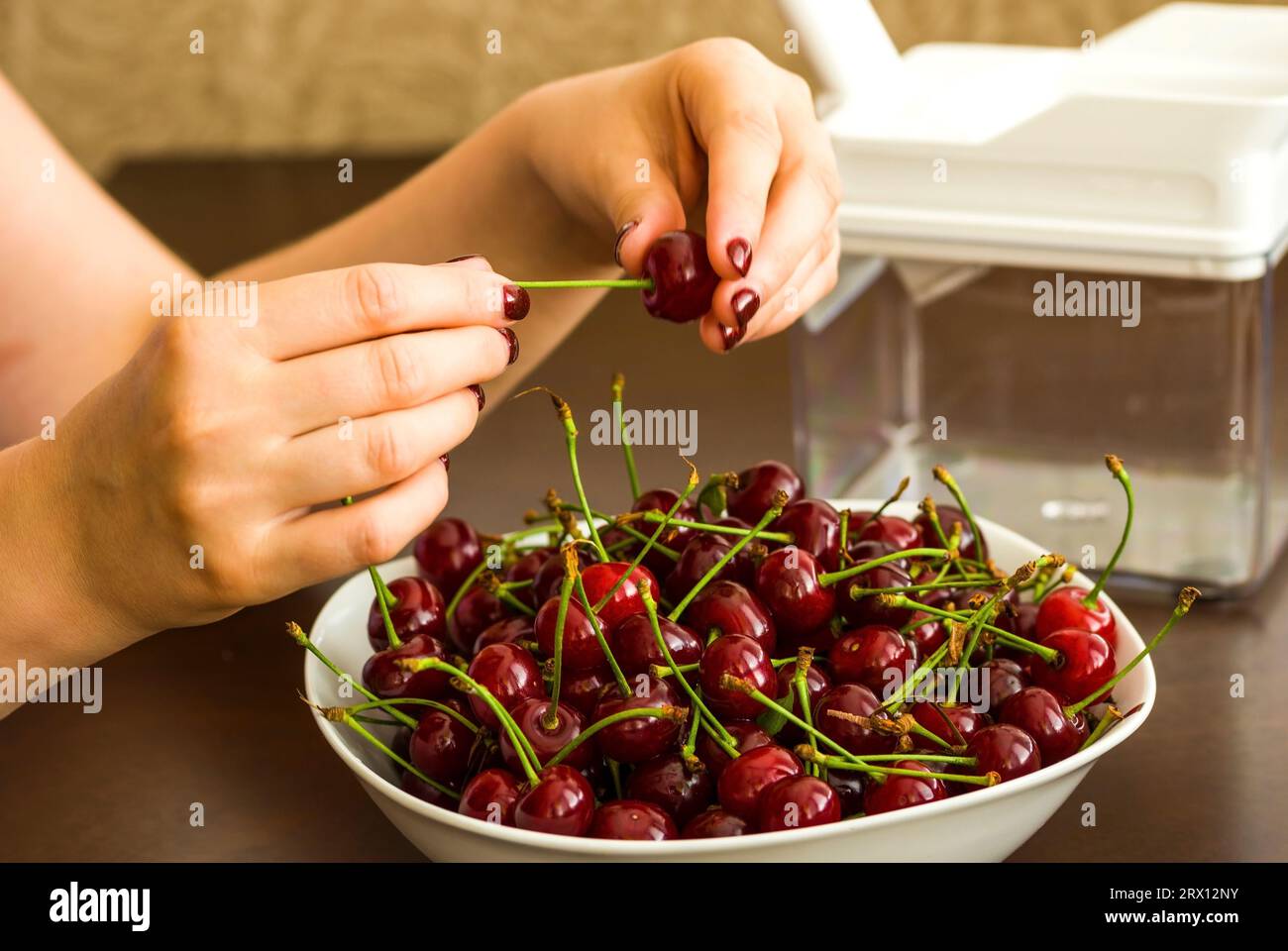 Removal of a stone from cherry. The plastic tool for processing of ...