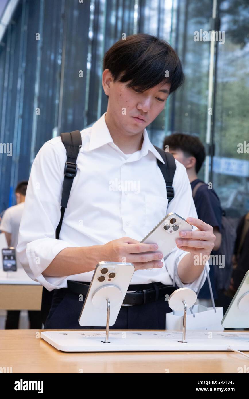 Tokyo, Japan. 22nd Sep, 2023. Customer interacts with the new iPhone 15 ...