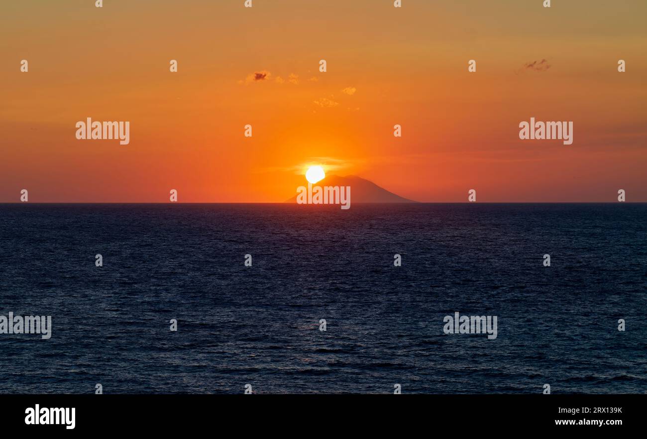 Tropea Calabria Italy. The sun sets in the crater mouth of Stromboli ...