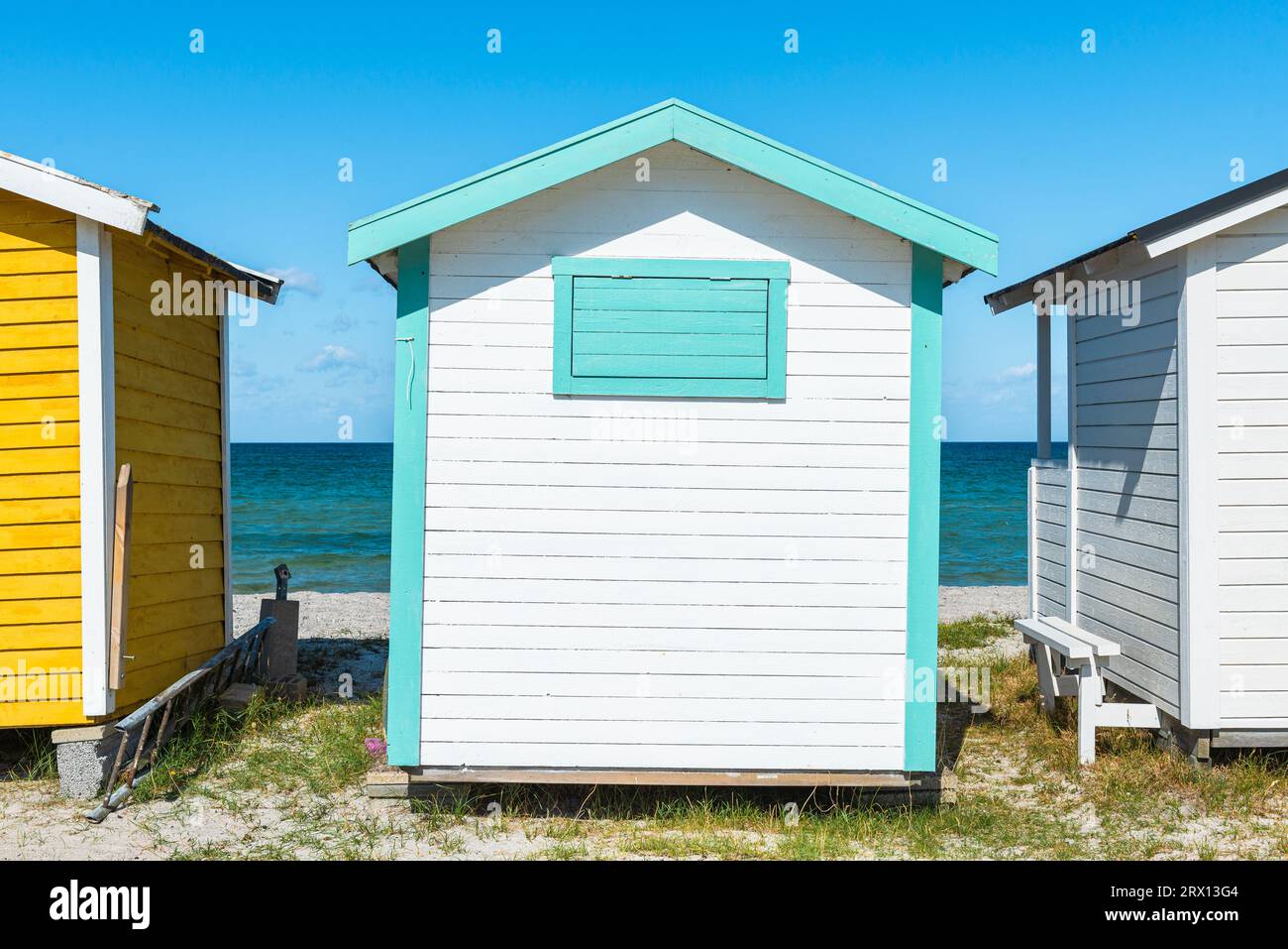 Frontal view of the back of a white turqoise wooden bathing hut on the ...