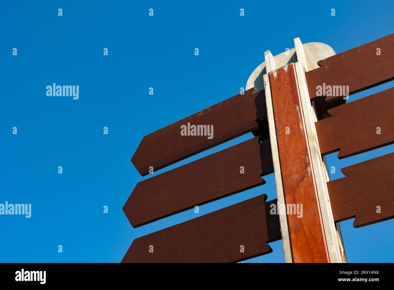 Multiple directional signs on the signpost with copy space for texts ...