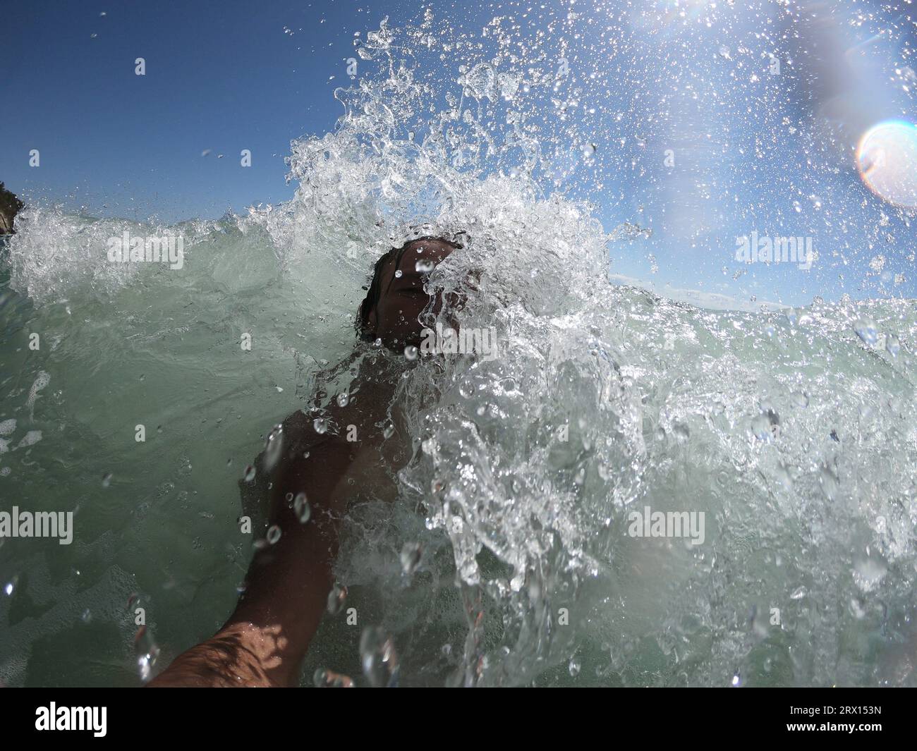 Powerful windy ocean waves splashing on a guy Stock Photo - Alamy