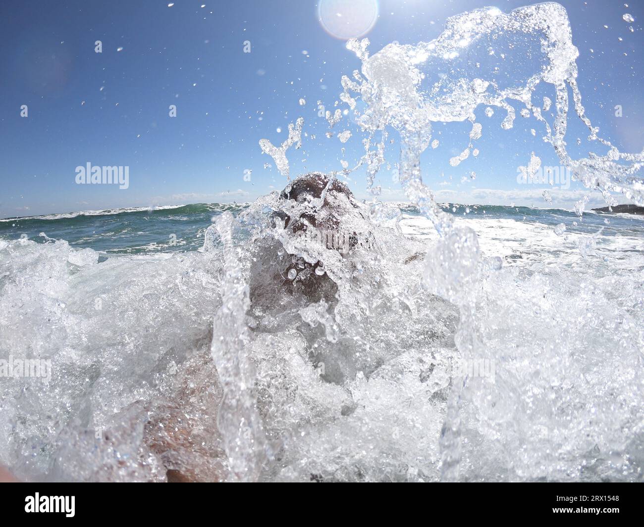 Powerful windy ocean waves splashing on a guy Stock Photo - Alamy