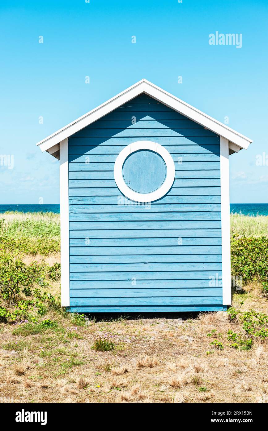 Frontal view of the back of a blue white wooden bathing hut on the ...
