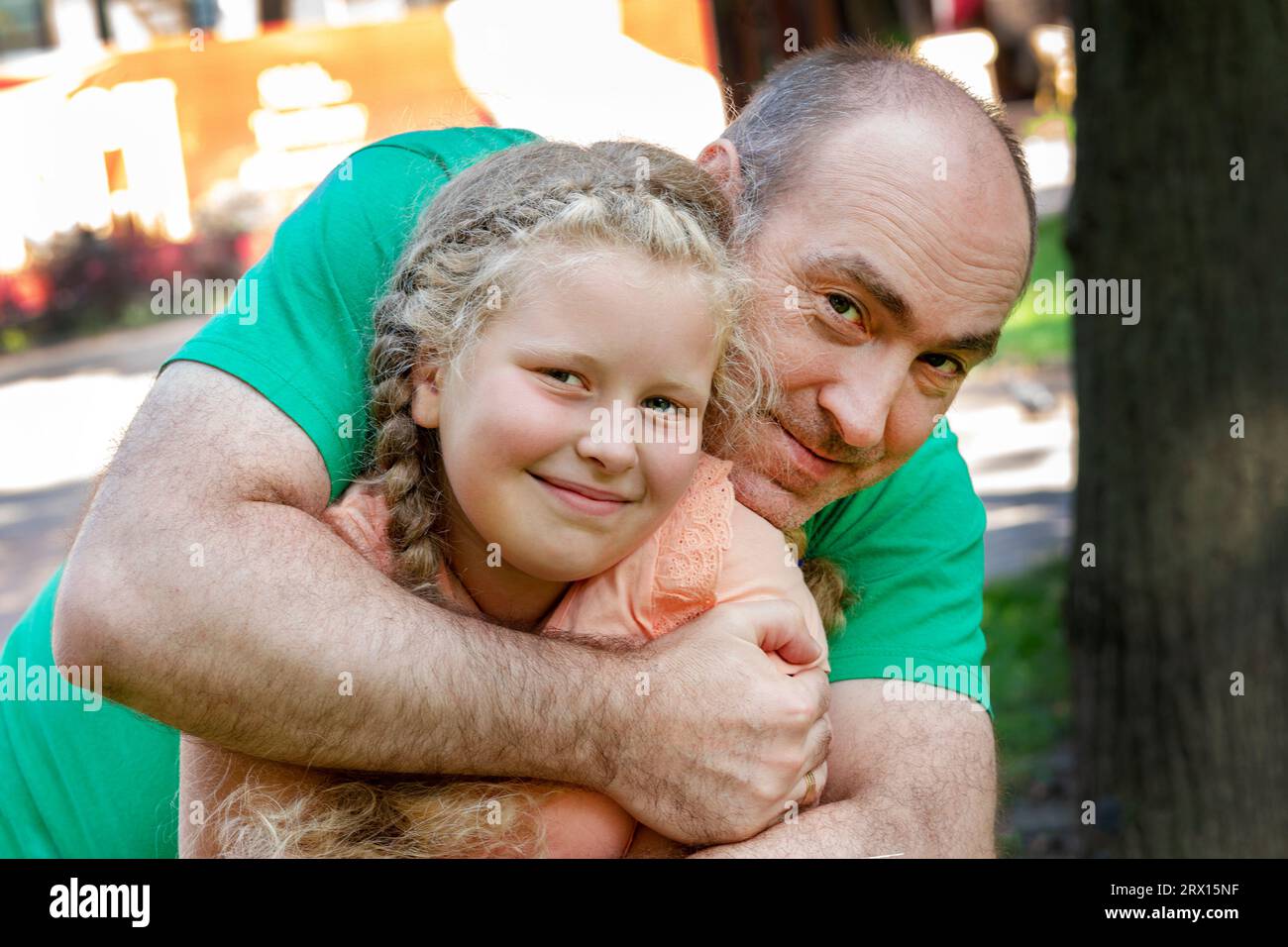 Happy father with the daughter. Daughter and father hugs. The concept ...