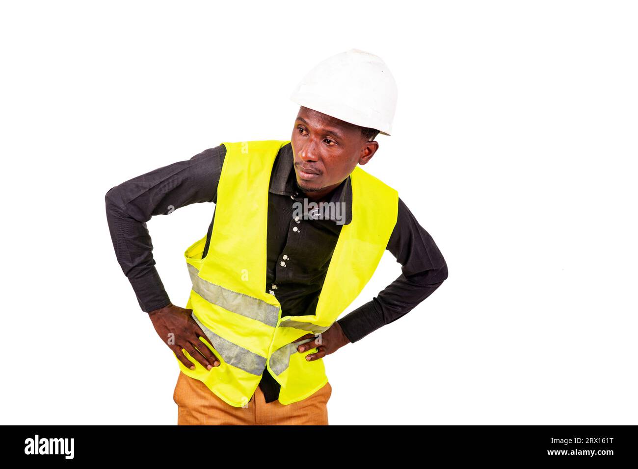 young man engineer wearing green vest and white safety helmet while ...