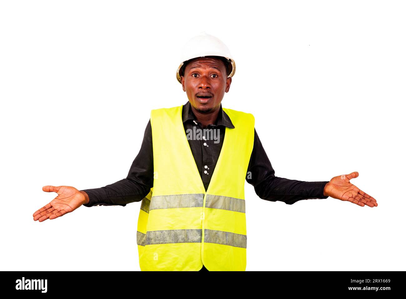 Confused young man engineer wearing green vest and white safety helmet ...