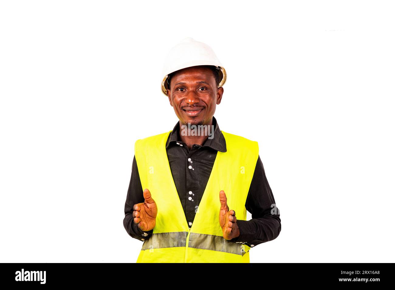 young man engineer wearing green vest and safety helmet while showing ...