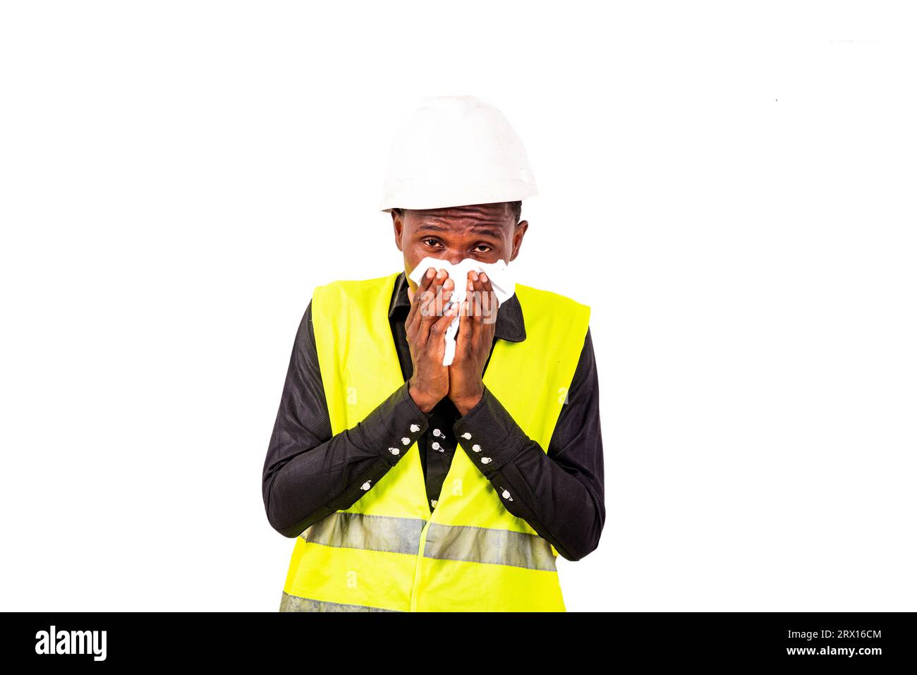Man in safety vest sneezing hi-res stock photography and images - Alamy