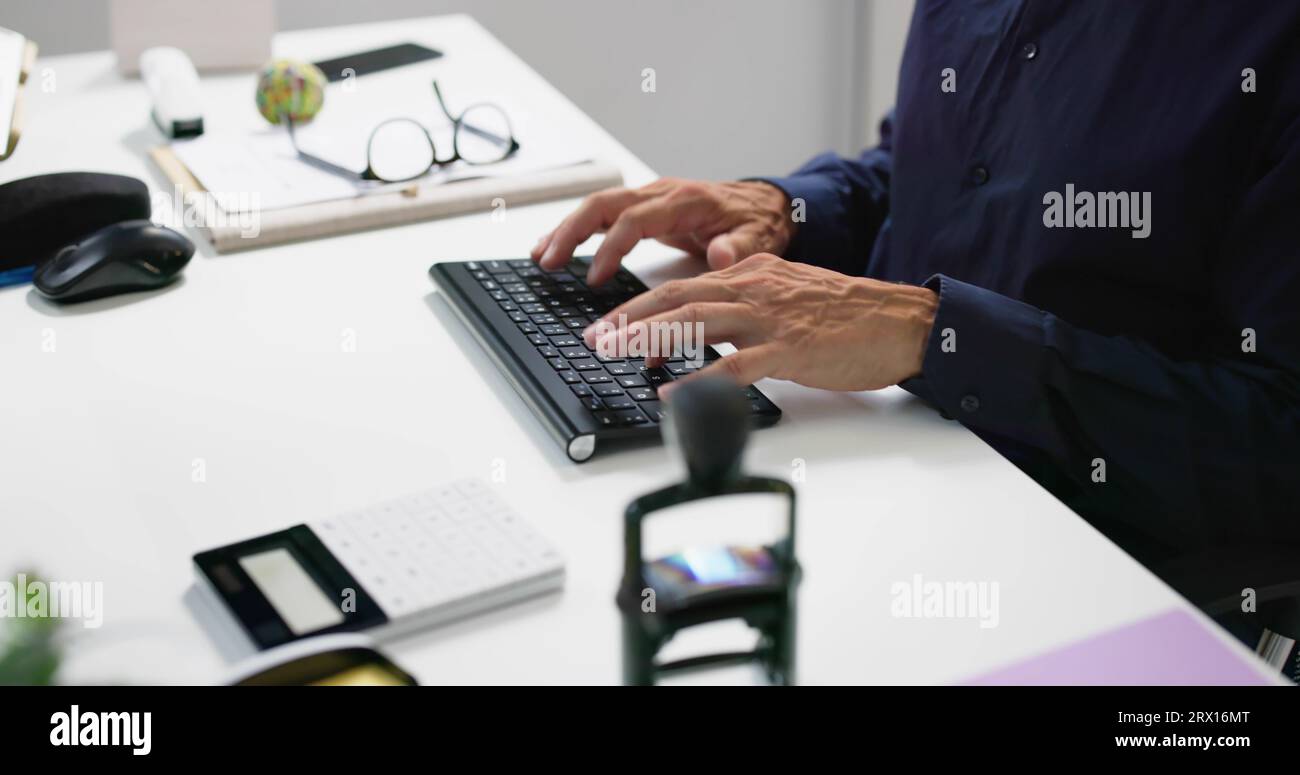 Man Working In Office On Desktop PC Stock Photo - Alamy