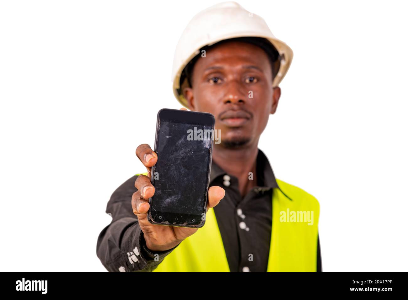 young man engineer wearing green vest and safety helmet while showing ...