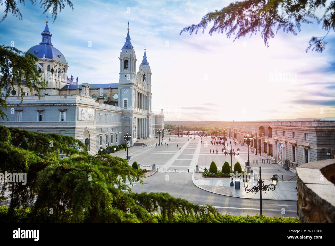 Almudena Cathedral and Plaza Armeria square through foliage Stock Photo ...