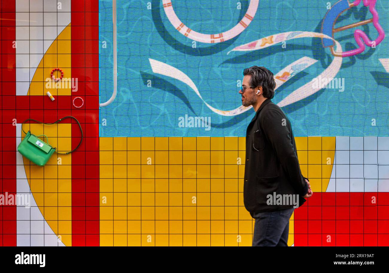 Man walking past the Hermes store window in Bond St, London Stock Photo ...