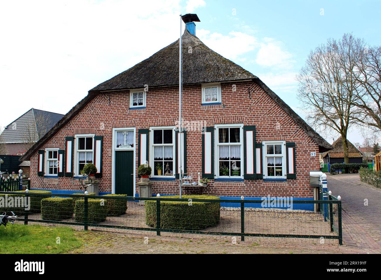 Staphorst, Netherlands. Facade of the typical farm house painted in ...