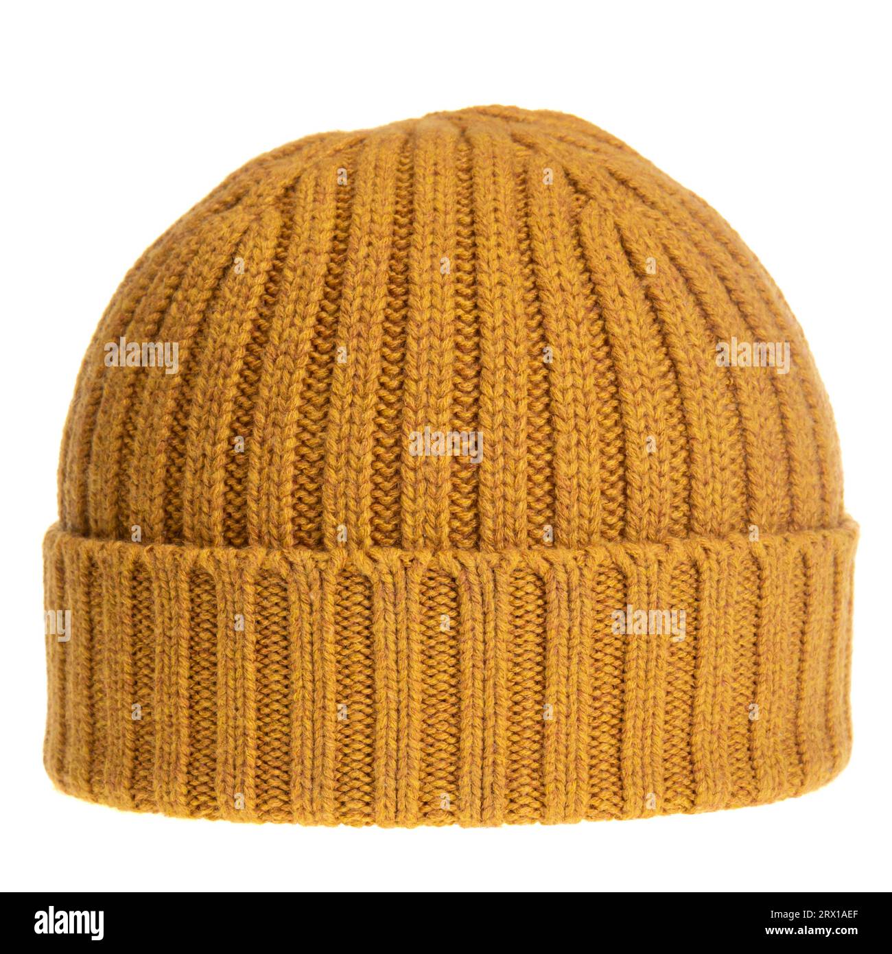 Orange-yellow knitted winter bobble hat of traditional design isolated ...