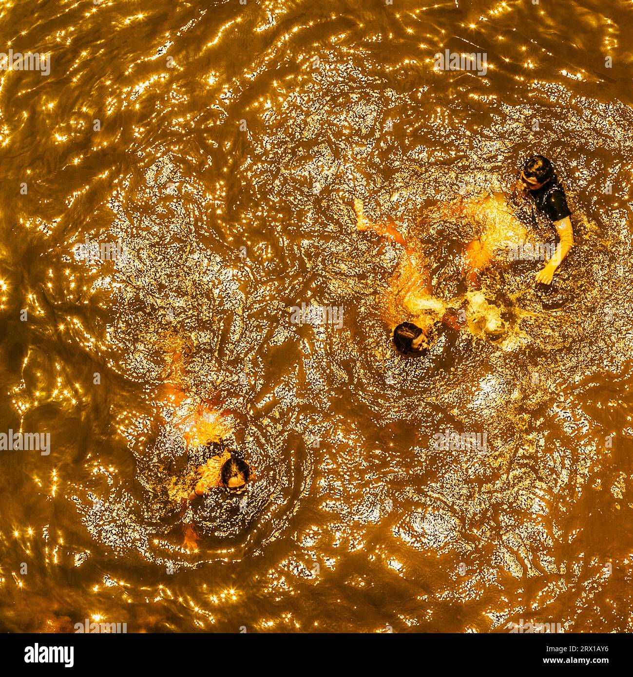 People plating in a river Stock Photo - Alamy