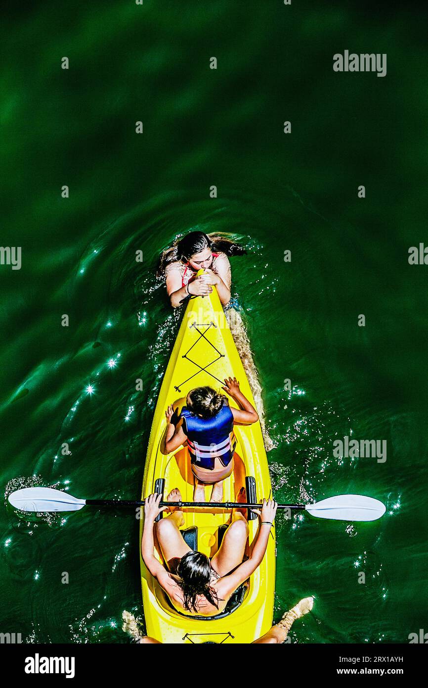 Young people in a kayak Stock Photo - Alamy