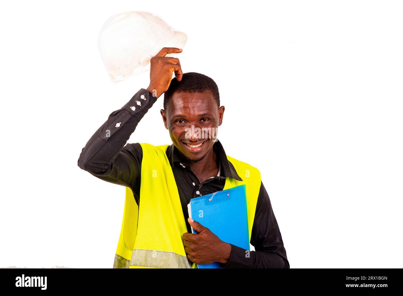 young man inspector architect wearing green vest and dyed safety helmet ...