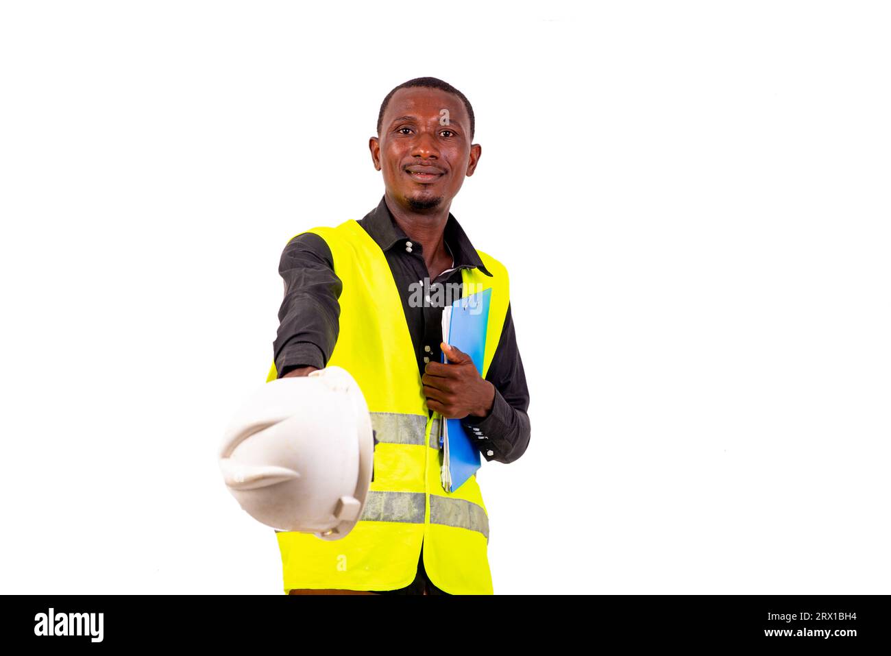 young man inspector architect wearing green vest and holds clipboard ...