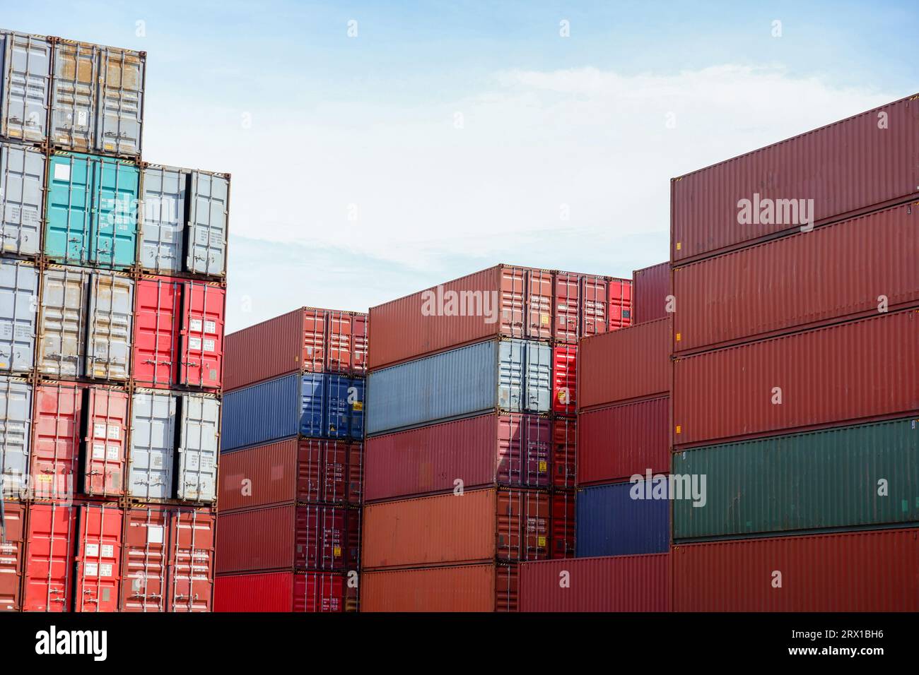 Containers piled up at the port Stock Photo - Alamy
