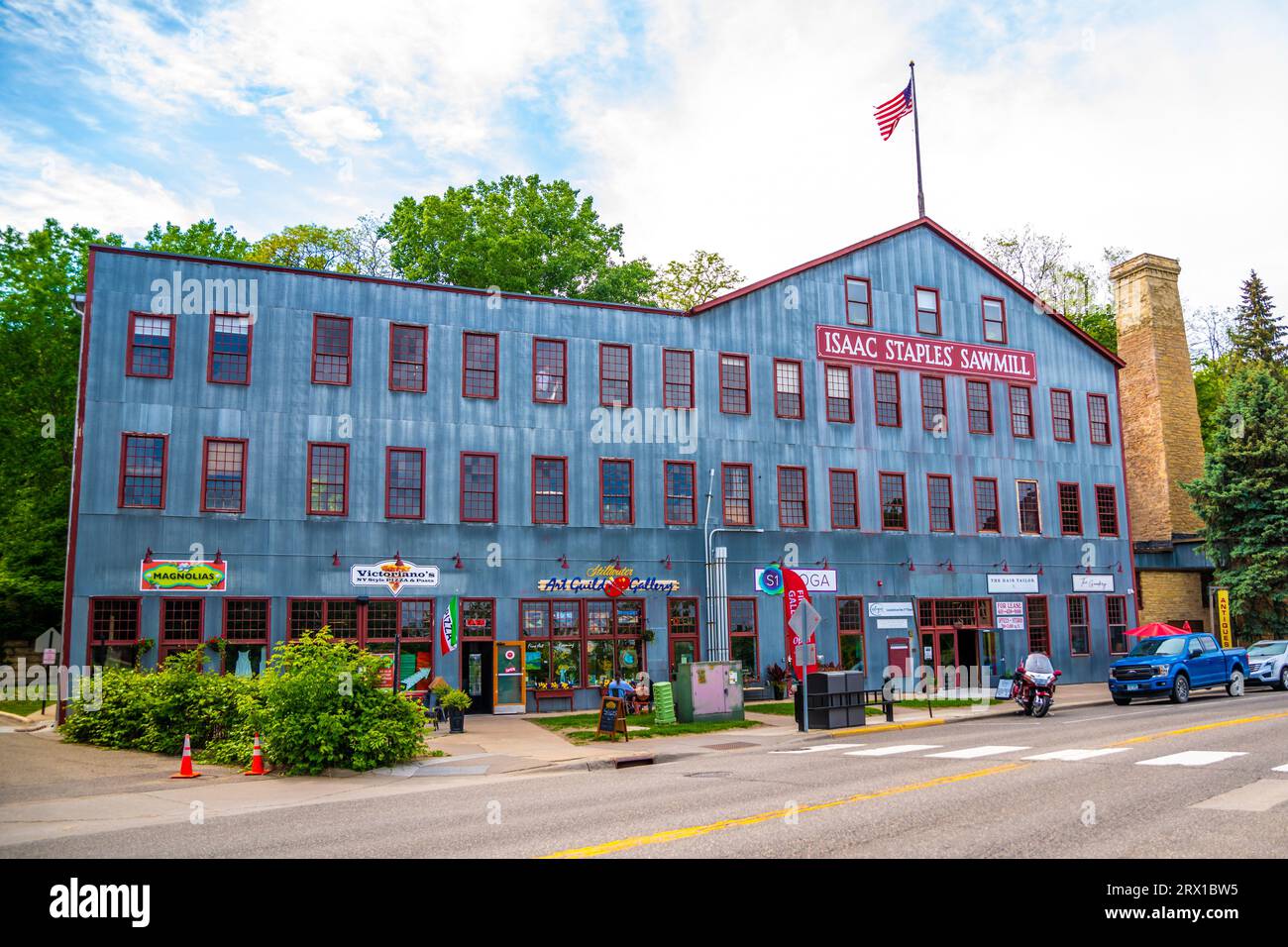 A historic stone powerhouse and a metal clad factory in Stillwat Stock ...
