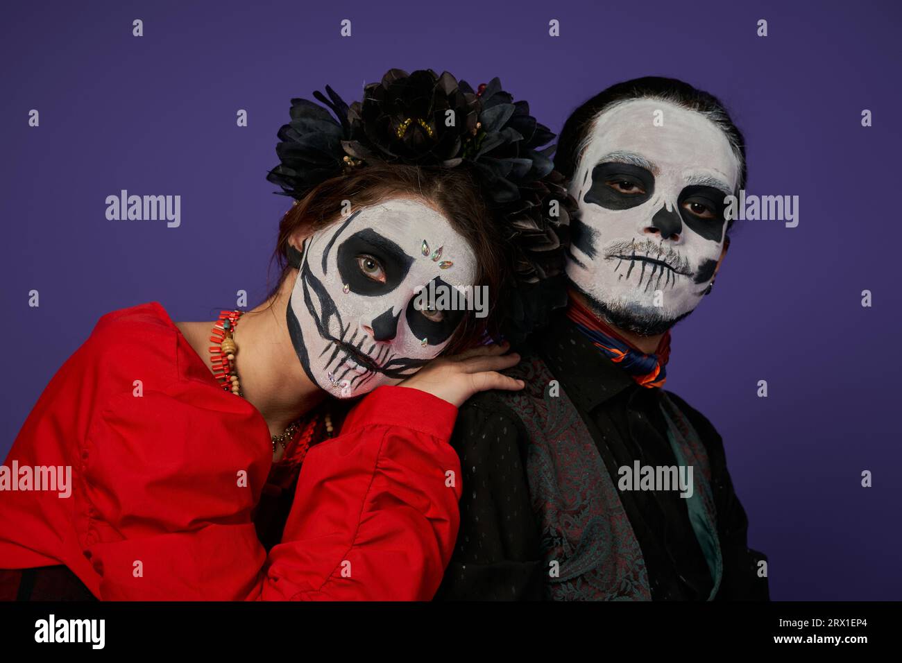 woman in sugar skull makeup and black wreath leaning on shoulder of ...
