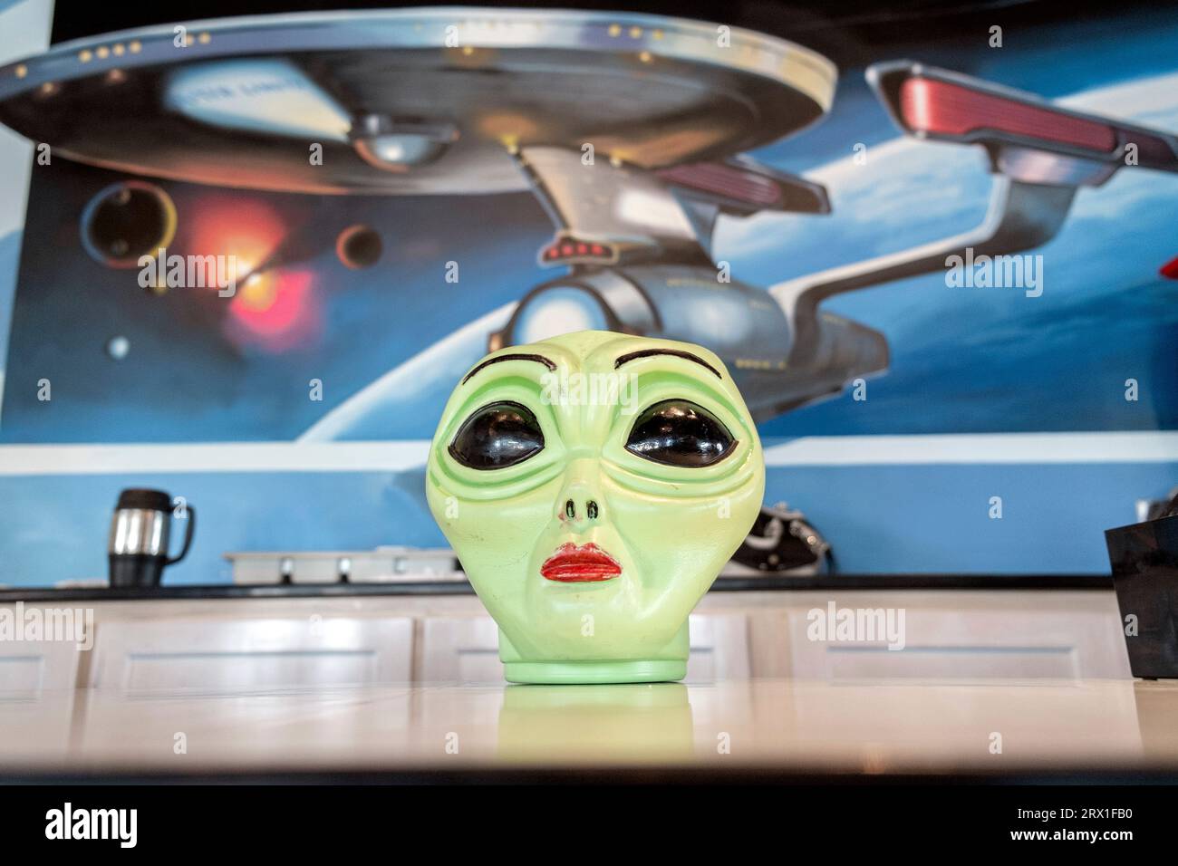 Alien head on the counter of a space aged roadside diner Stock Photo ...